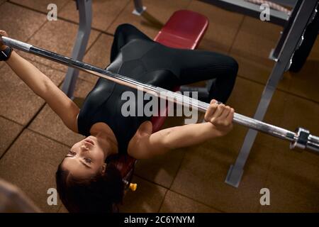 Powerlifter with strong arms lifting barbell in a gym Stock Photo - Alamy