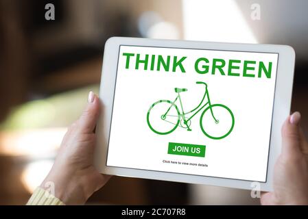 Tablet screen displaying a think green concept Stock Photo - Alamy