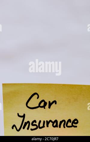 Car insurance handwriting text close up isolated on yellow paper with ...
