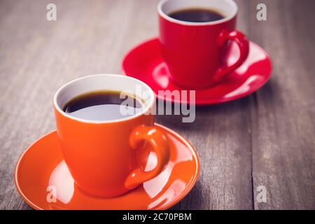 two new cups fool of coffee on wooden background Stock Photo - Alamy