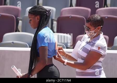 Southern California Trojans coach Caryl Smith Gilbert (right) assists ...