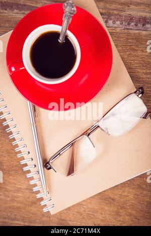 red cup fool of coffee with notebook on wooden background Stock Photo ...