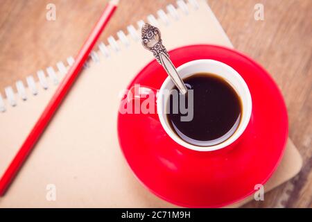 red cup fool of coffee with notebook on wooden background Stock Photo ...