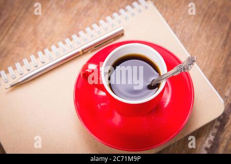 red cup fool of coffee with notebook on wooden background Stock Photo ...