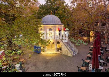 Koza Han tea gardens and mosque in Koza Han Silk Bazaar. Koza Han is ...