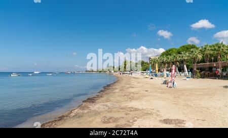 Balikesir, Erdek, Turkey - July 2019: Beach of Erdek with people under ...