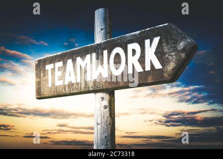Teamwork - white wooden signpost with one arrow Stock Photo - Alamy