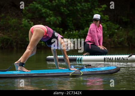 Acworth, GA, USA. 12th July, 2020. Stand Up Paddleboard yoga session ...
