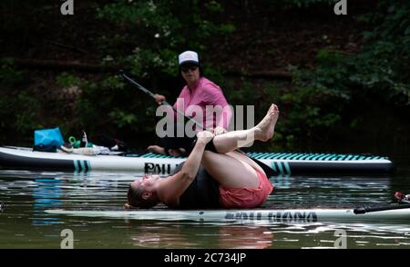 Acworth, GA, USA. 12th July, 2020. Stand Up Paddleboard yoga session ...