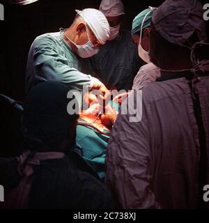 1960s MAN DOCTOR SURGEON WITH A WOMAN ATTENDANT SURGICAL NURSE ...