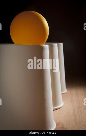 Disposable paper cups and ping pong ball Stock Photo - Alamy