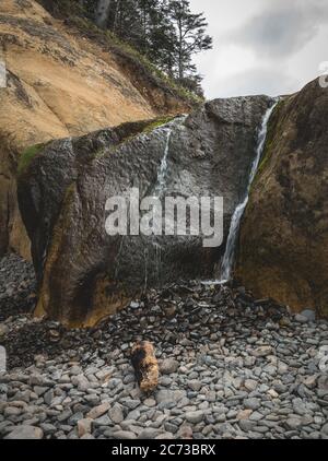 Waterfall at Hug Point Beach in Oregon Stock Photo - Alamy