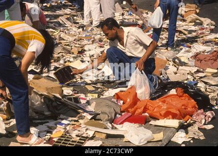 CARACAS, VENEZUELA, MARCH 2,1989 - People scavenging remnants of looted ...
