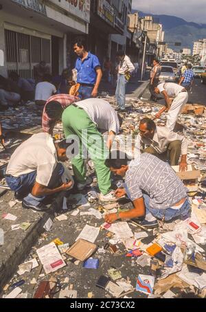 CARACAS, VENEZUELA, MARCH 2,1989 - People scavenging remnants of looted ...