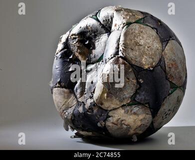 Damaged soccer ball Stock Photo - Alamy