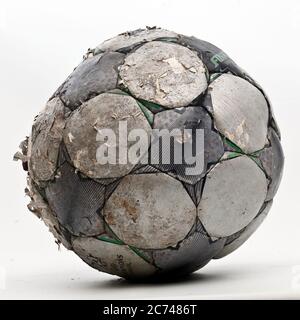 Damaged soccer ball Stock Photo - Alamy