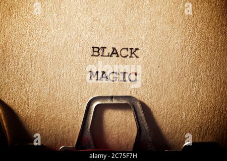 Black magic text written with a typewriter Stock Photo - Alamy