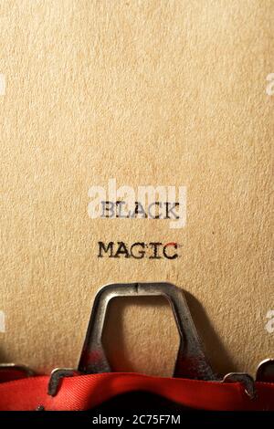 Black magic text written with a typewriter Stock Photo - Alamy