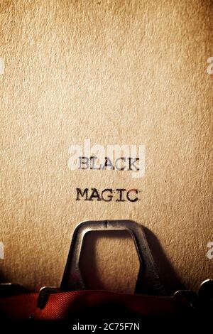 Black magic text written with a typewriter Stock Photo - Alamy