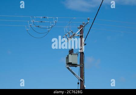 An electricity supply pylon delivering rural power through the UK ...