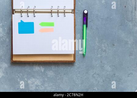 Text COVID-19 with red pencil on a spiral notebook. Conceptual image of ...