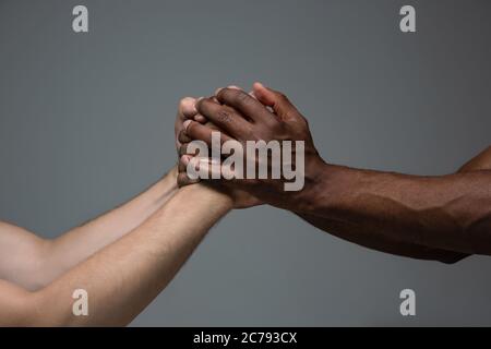 Helping hands. Racial tolerance. Respect social unity. African and ...