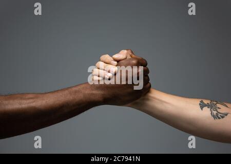Helping hands. Racial tolerance. Respect social unity. African and ...