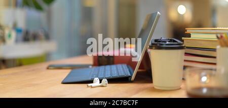 notebook paper with Earphone and keyboard on wooden table Stock Photo ...