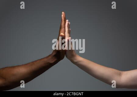 Teamwork. Racial tolerance. Respect social unity. African and caucasian ...