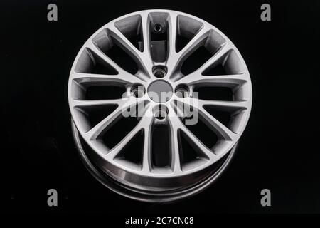 multi-spoke gray alloy wheel on black background Stock Photo - Alamy