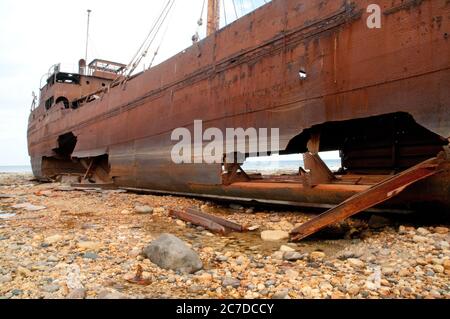 The 1960's era shipwreck the 'SS Ithaca' at low-tide grounded on the ...
