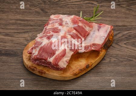 Raw pork ribs served rosemary for cooking Stock Photo - Alamy