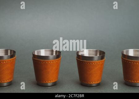 Metallic shot glasses in a row. steel funnel. travel shot glass for ...