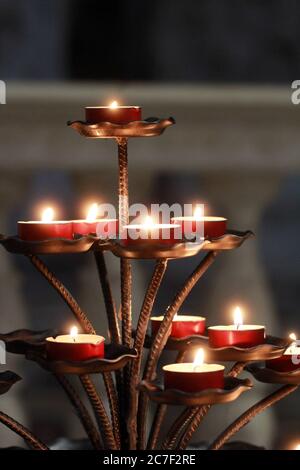 burning candles in church golden light Stock Photo - Alamy