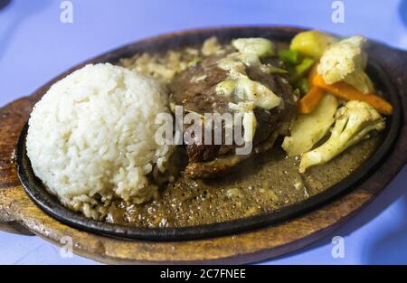 Traditional yak steak served in a restaurant at Ranipauwa town, Lower ...