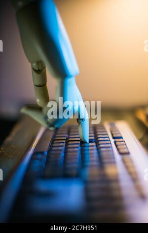 Artificial hand and computer keyboard Stock Photo - Alamy
