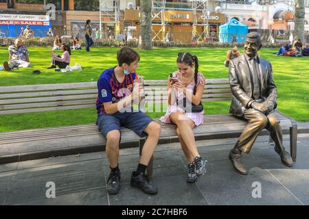 Mr Bean statue in Leicester Square with face covering Stock Photo - Alamy