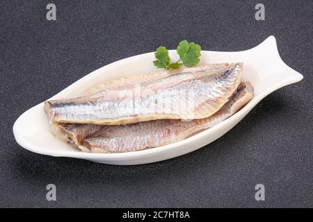 Herring fillet in the bowl with spices Stock Photo - Alamy