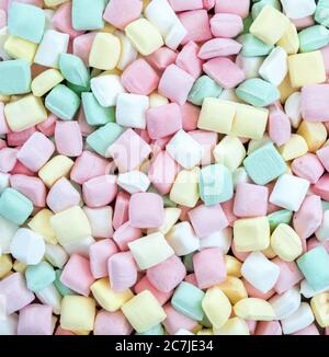 Vertical Image Of Pile Of Pastel Pink Oval Shaped Pills For Background