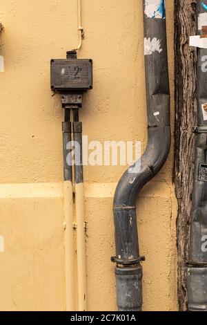 old electric connection box with cables and conduit coming out the ...