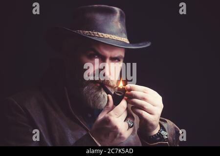 cowboy man smoke pipe Stock Photo - Alamy