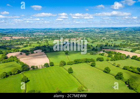 Typical English countryside landscape with hills, fields and hedgerows ...
