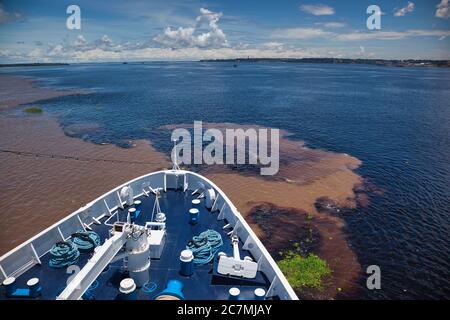 The confluence of the Amazon River and the Rio Negro at Manaus Brazil ...