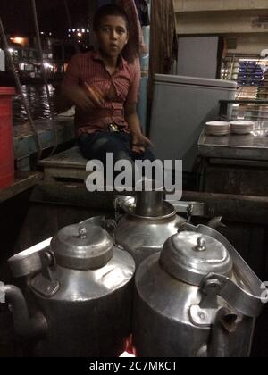Boy selling tea at a market stall Stock Photo - Alamy