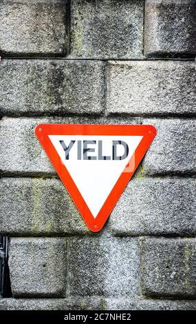 A vertical shot of a red white yield sign on a pole Stock Photo - Alamy