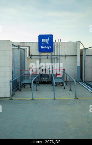 Trolley shopping cart return sign in a carpark Stock Photo - Alamy