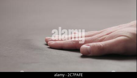 man hand checking brown leather piece closeup, wide photo Stock Photo ...