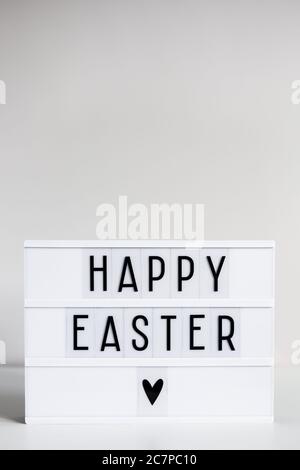 Close up of vintage lightbox with word Easter on the table and copy ...