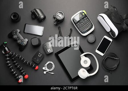 Different modern devices on dark background Stock Photo - Alamy