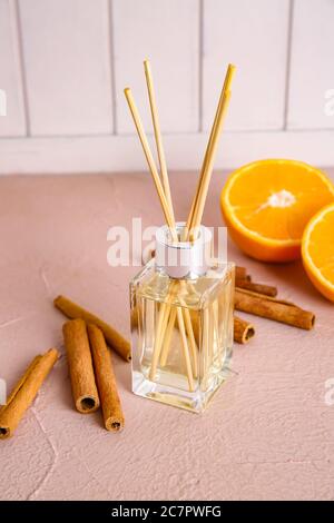 Reed diffuser with cinnamon and orange on white background Stock Photo ...